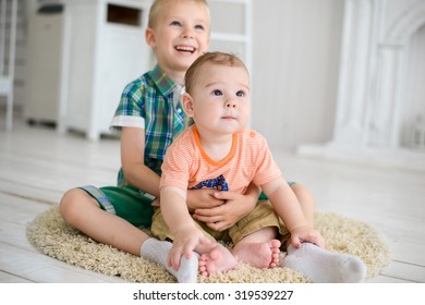 Two Children Playing While Sitting On Stock Photo 319539227 | Shutterstock