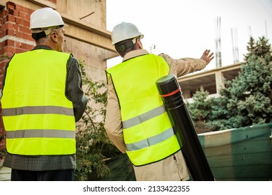 Two Construction Workers Standing Construction While Stock Photo ...