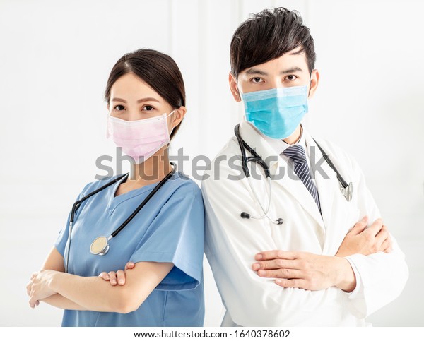 Two Doctors Faces Wearing Protective Mask Stock Photo 1640378602 ...