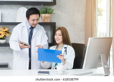Two Doctors Work Together Tablet Desktop Stock Photo 618538799 ...
