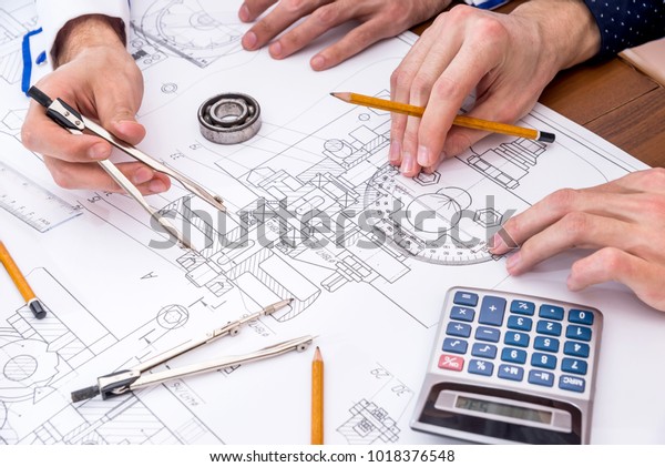 Two Engineers Discussing Engineering Drawing Office Stock Photo (Edit ...