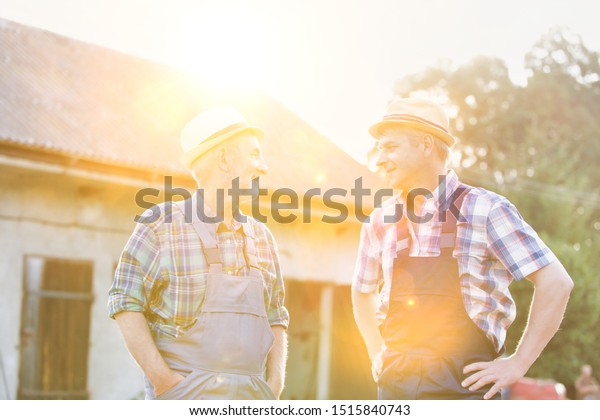 Two Farmers Standing While Talking Barn Stock Photo 1515840743 ...