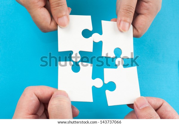 Two Hands Holding Jigsaw Puzzle Pieces Stock Photo (Edit Now) 143737066 Two Hands Holding Jigsaw Puzzle Pieces Stock Photo (Edit Now) 143737066