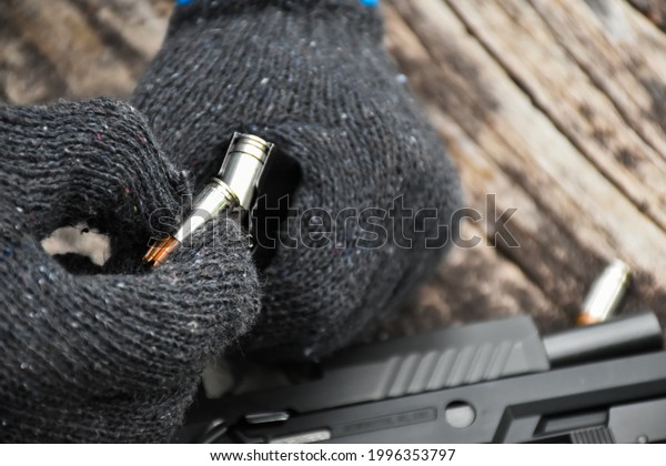 Two Hands Reloading 9mm Bullets Full Stock Photo 1996353797 | Shutterstock