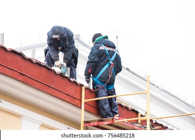 Two Highaltitude Workers Work On Roof Stock Photo (Edit Now) 756485218