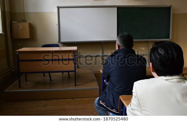 Two Men Sitting Classroom Looking Blackboard Stock Photo 1870525480 ...