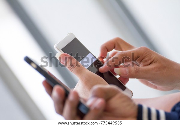 Two Men Using His Mobile Phone Stock Photo (Edit Now) 775449535