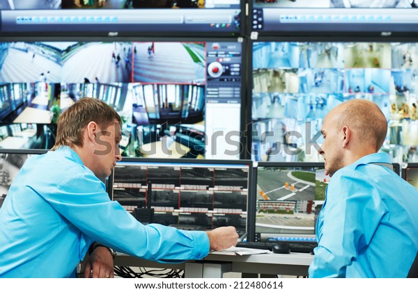 Two Security Guards Watching Video Monitoring Stock Photo (Edit Now ...