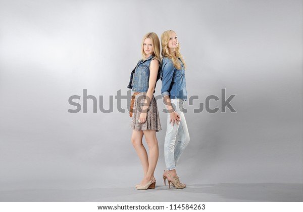 Two Sisters Posing Studio Stock Photo (Edit Now) 114584263