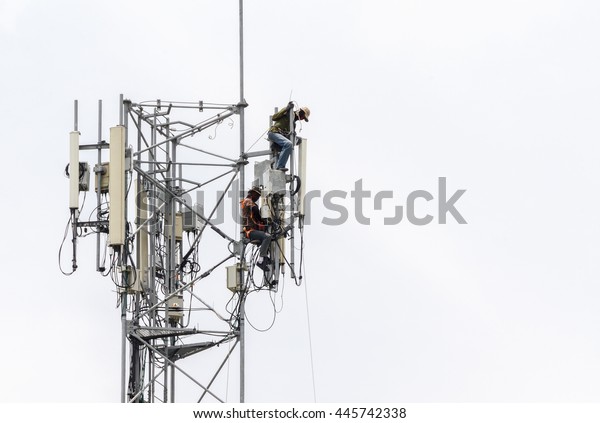 Two Technicians Working On Communication Towers Stock Photo 445742338 ...