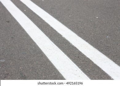 Two White Parallel Lines On Asphalt Stock Photo 492165196 | Shutterstock