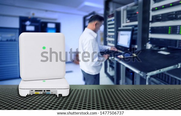 Two Wireless Access point and blur engineer working in data center room