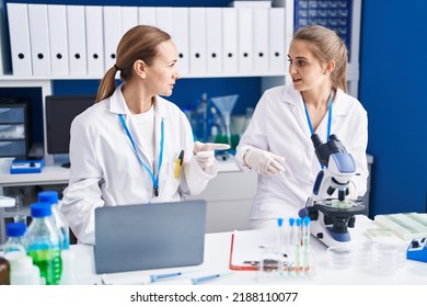Two Women Scientists Using Microscope Laptop Stock Photo 2188110077 ...