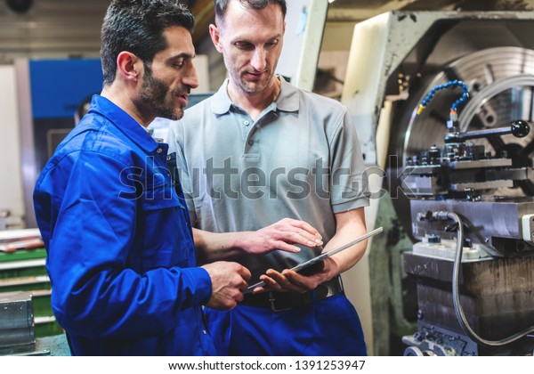 Two Workers Discussing Project Front Cnc Stock Photo 1391253947 ...