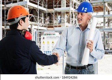1,714 2 construction workers shaking hands Images, Stock Photos ...