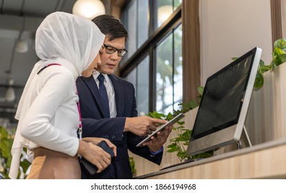 Two Young Office Workers Using Computer Stock Photo 1866194968 ...