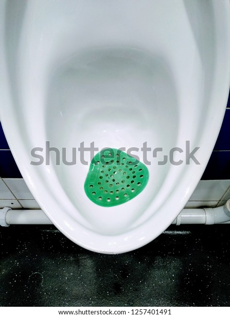 Стоковая фотография 1257401491: Urinal Splash Guard Mat Insert Prevent ...
