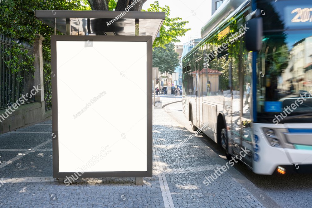 Vertical empty billboard in a bus stop with people in the background ...