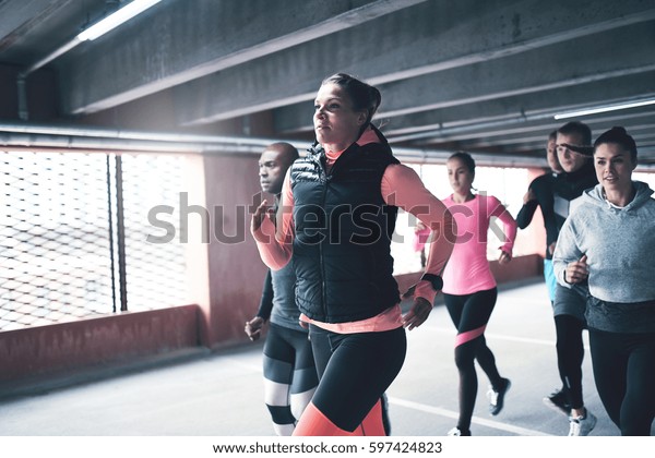 View Team Running Together While Practising Stock Photo 597424823 ...