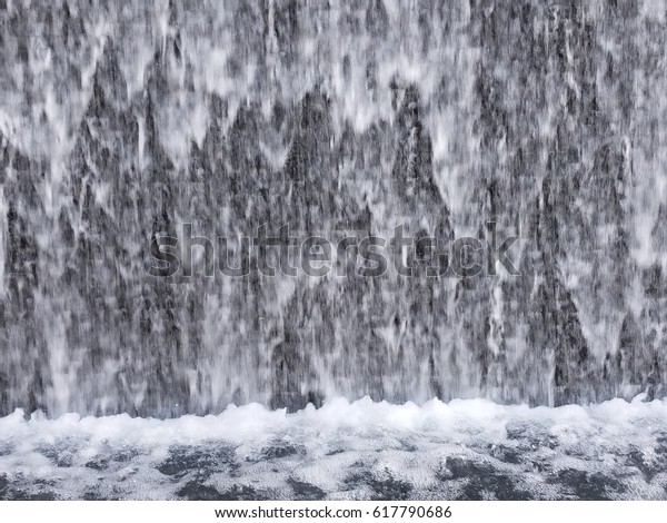 Water Falling Down Wall Into Pool Stock Photo (Edit Now) 617790686