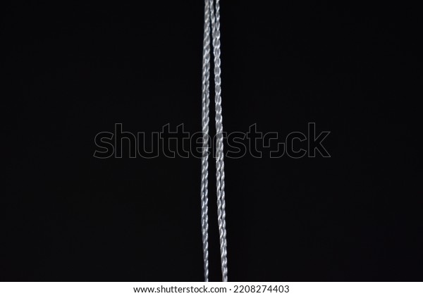 White Thread Hanging Vertically Against Black Stock Photo 2208274403 ...