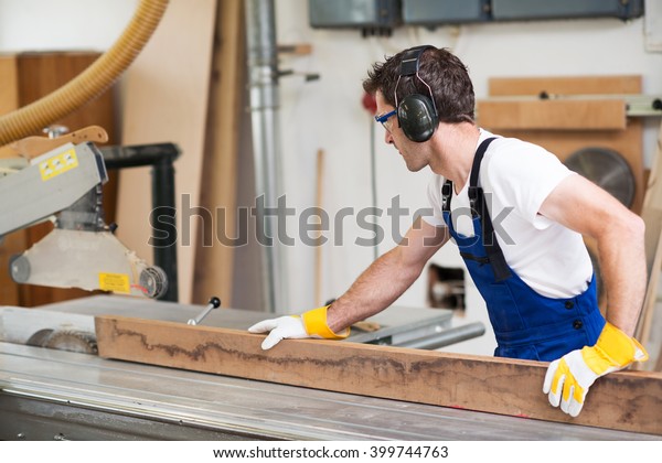 Worker Carpenters Workshop Using Saw Machine Stock Photo 399744763 ...