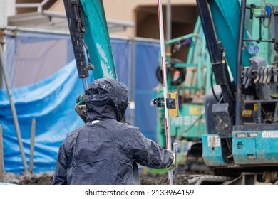 Worker Doing Construction Work Rain Stock Photo (Edit Now) 2133964159