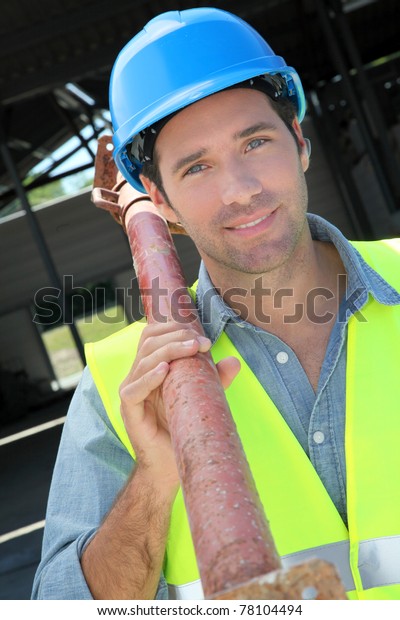 Worker Lifting Prop On Construction Site Stock Photo 78104494 ...