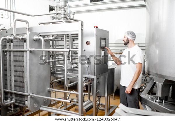 Worker Operating Pasteurizer Using Control Panel Stock Photo (Edit Now ...