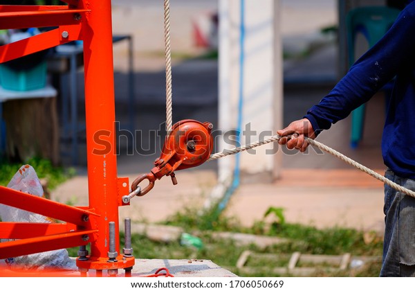 Worker Pulling Rope By Fixed Pulley Stock Photo 1706050669 | Shutterstock