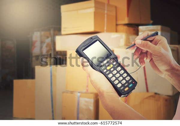 Worker Scanning Package Warehouse Stock Photo (Edit Now) 615772574