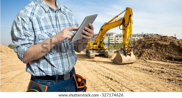 Worker Using Tablet Construction Site Stock Photo (Edit Now) 327174626
