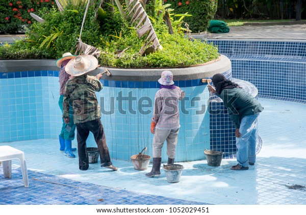 Workers Cleaning Pool Stock Photo (Edit Now) 1052029451