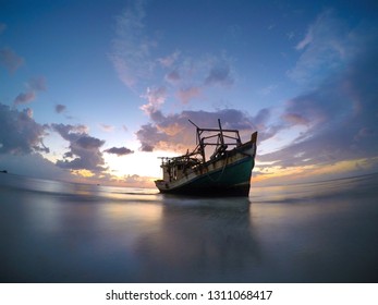 Wrecked Ship On Beach While Sunset Stock Photo 1311068417 | Shutterstock