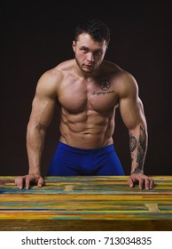 Young Bodybuilder Posing On Table On Stock Photo 713034835 | Shutterstock
