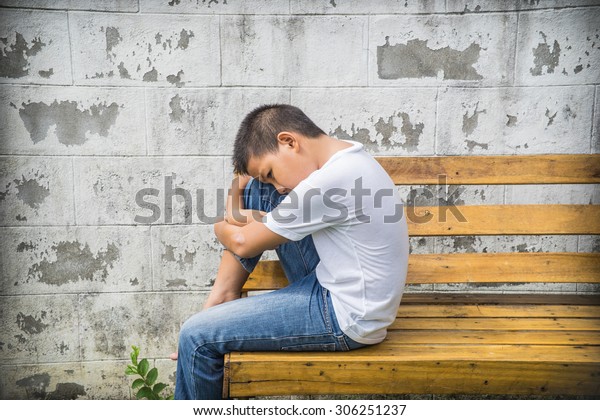 Young Boy Alone On Bench Stock Photo (Edit Now) 306251237