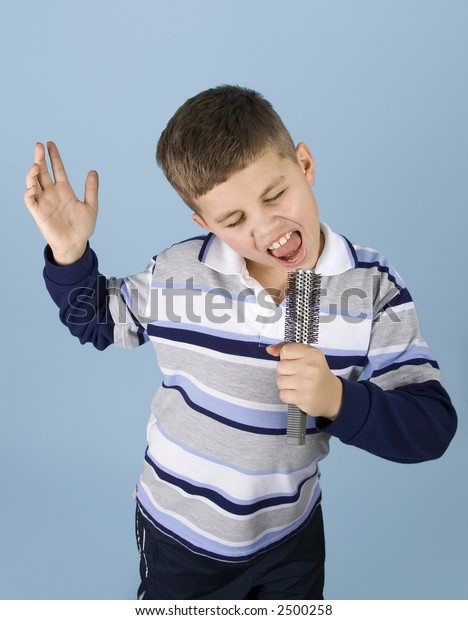 Young Boy Dancing Singing Into Hair Stock Photo (Edit Now) 2500258