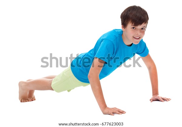 Young Boy Doing Push Ups Isolated Stock Photo (Edit Now) 677623003