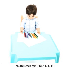 Young Boy Sitting Down Table Paper Stock Photo 1301194045 | Shutterstock