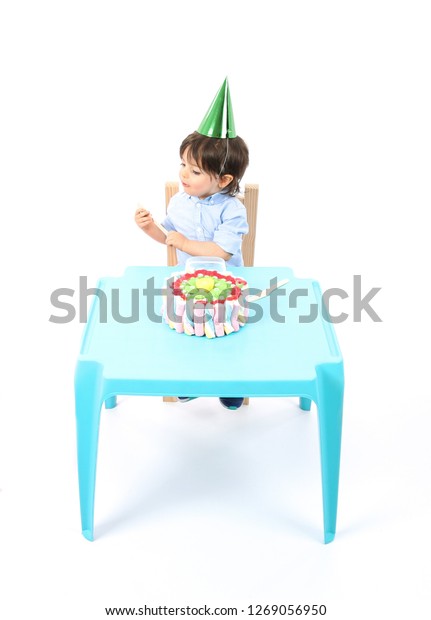 Young Boy Sitting Down Table While Stock Photo 1269056950 | Shutterstock