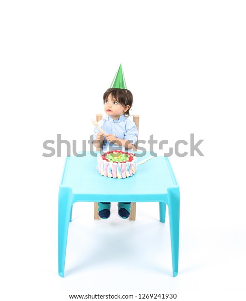 Young Boy Sitting Down Table While Stock Photo 1269241930 | Shutterstock