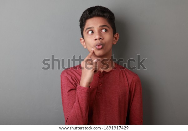 Young Boy Thinking Face Stock Photo 1691917429 | Shutterstock