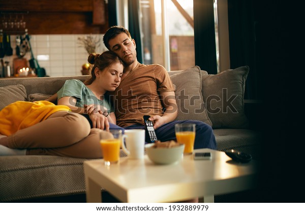 Young Couple Napping While Relaxing On Stock Photo 1932889979 ...