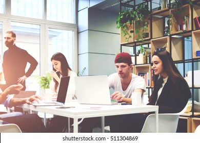 Young Creative Professionals Using Wireless Technology Stock Photo ...