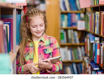 Young Girl Using Tablet Computer Library Stock Photo 283564937 ...