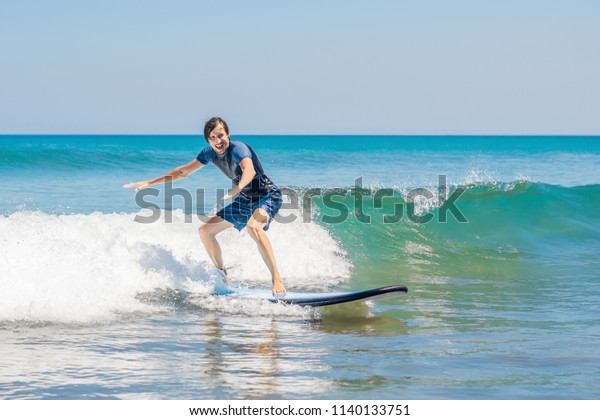 Young Man Beginner Surfer Learns Surf 스톡 사진 1140133751 | Shutterstock