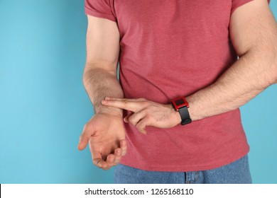 Young Man Checking Pulse On Color Stock Photo 1267927816 | Shutterstock