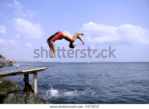 Young Man Doing Back Flip Into Stock Photo (Edit Now) 5472013