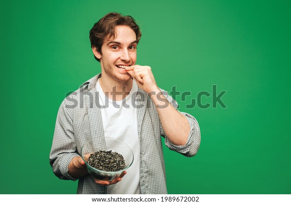 Young Man Eats Sunflower Seeds Isolated Stock Photo 1989672002 ...