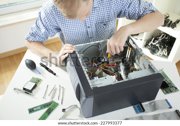 Young Man Fixing Computer On His Stock Photo 227993377 | Shutterstock